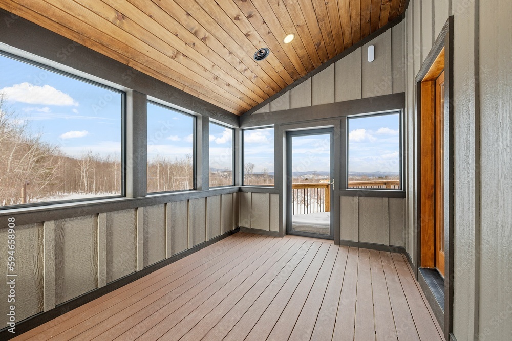 Empty balcony with doors and a sliding glass door opens to the outside ...
