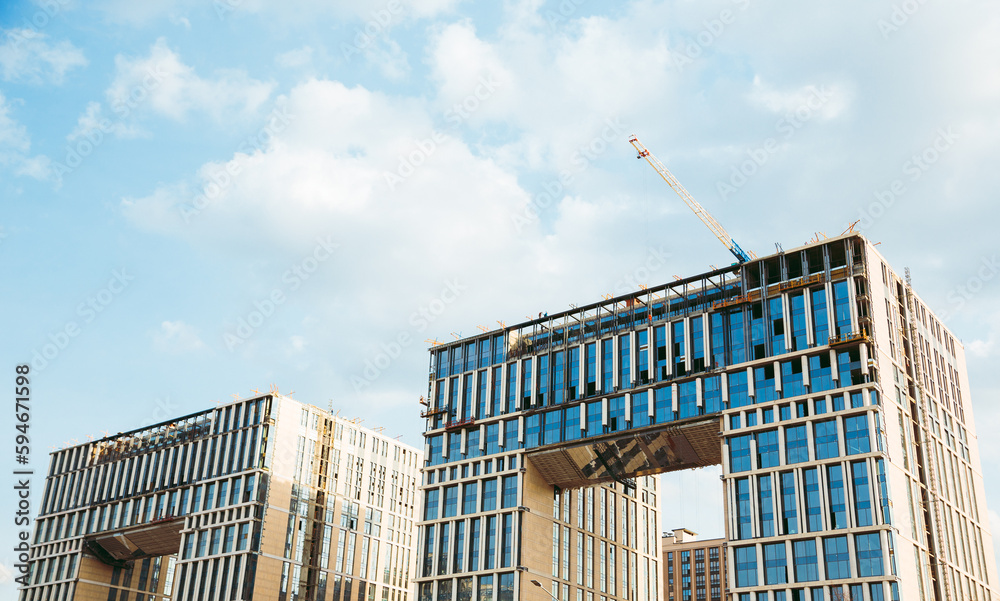 Construction site. Construction cranes and a building under ...