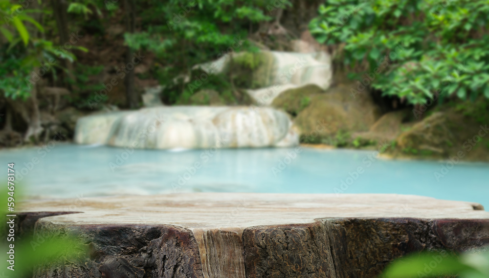 Wood table top podium floor in outdoor waterfall green tropical forest ...