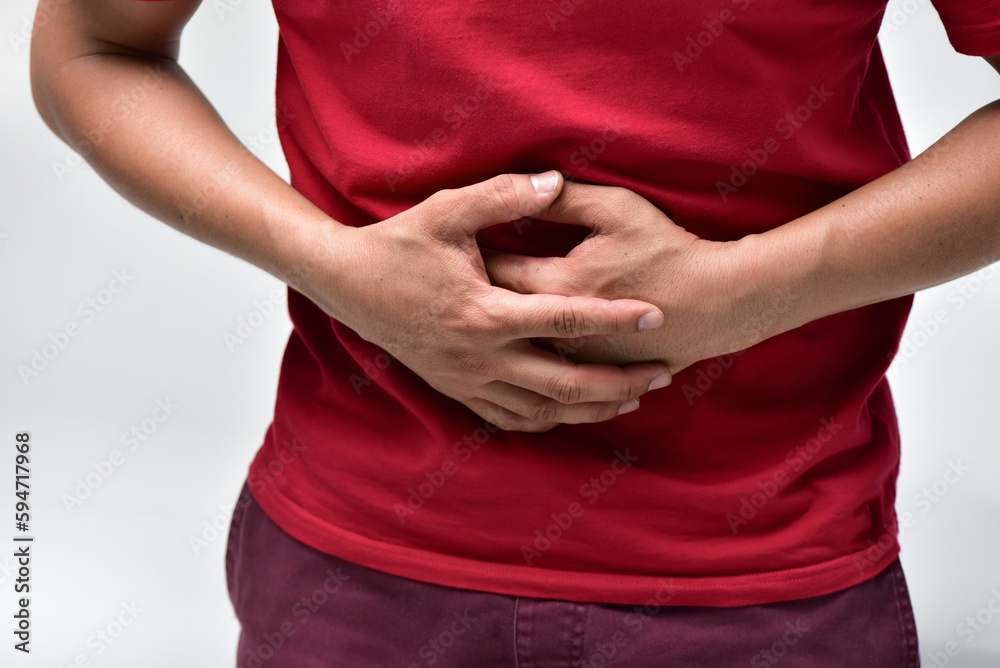 Asian men suffering from abdominal pain, abdominal pain, food poisoning ...
