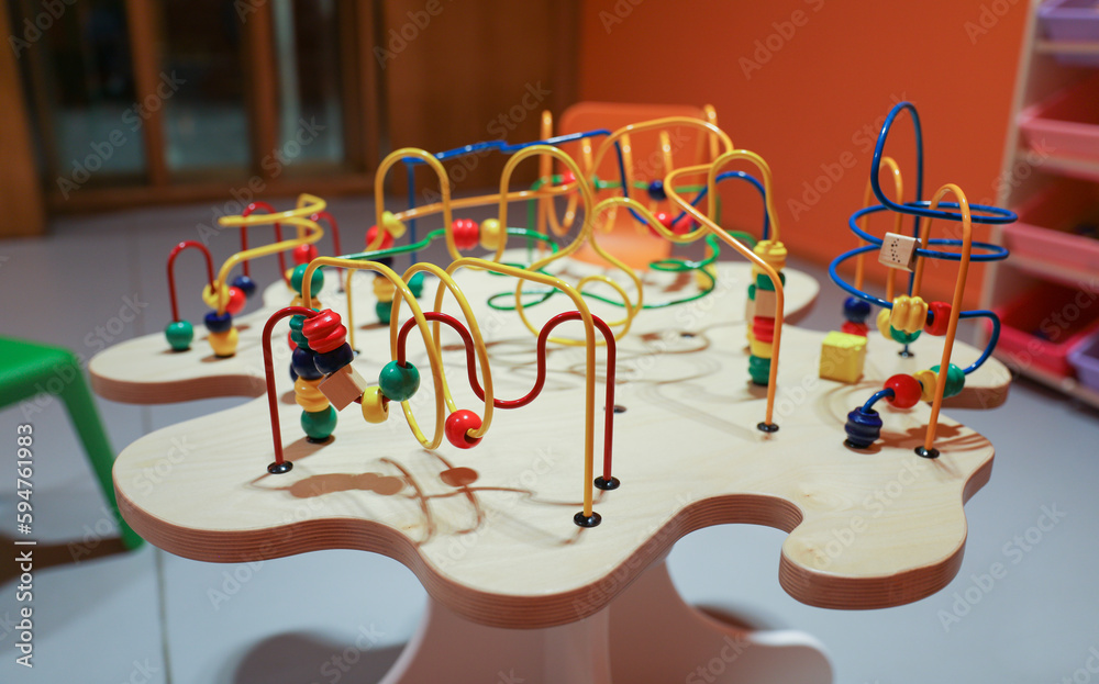 classic beads maze toy featuring colorful beads on wires, which kids ...