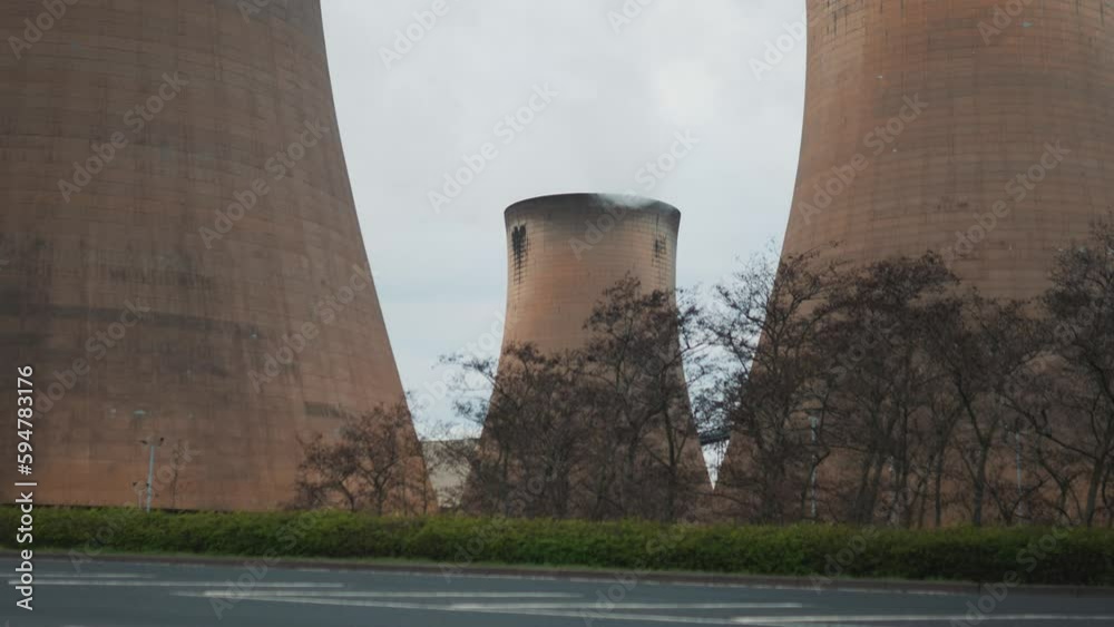 Cooling towers at a power plant, large nuclear plant, factory facility ...