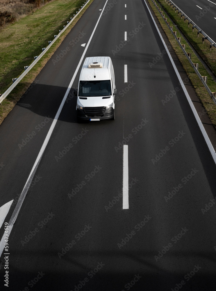 White delivery van on the highway. White modern delivery small shipment ...