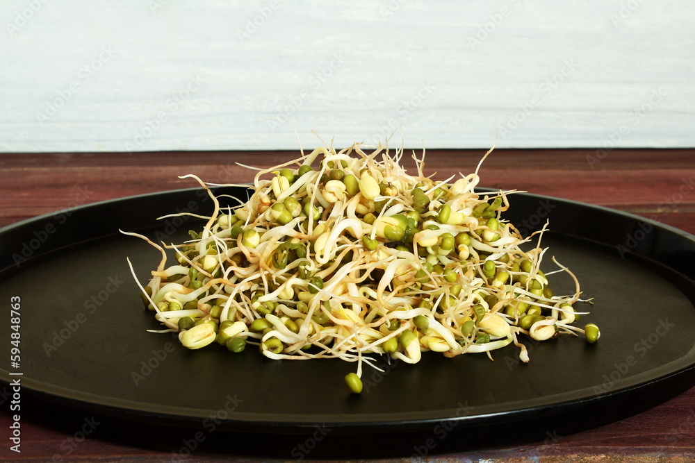 heap of sprouted green mung or moong beans also known as green gram ...