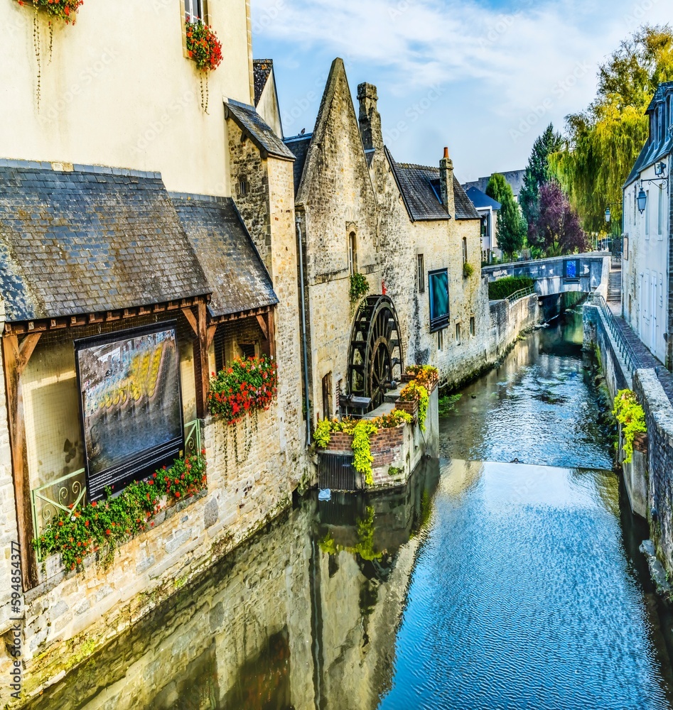 Colorful old buildings, Aure River reflection, Bayeux, Normandy, France ...