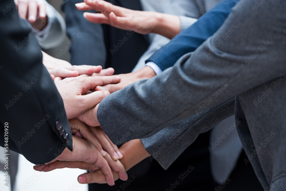 Foto de business people putting join hands together. Unity and teamwork ...