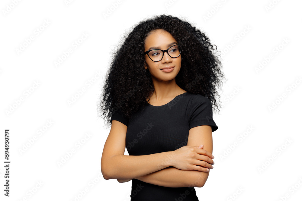 Photo of thoughtful satisfied Afro woman keeps hands crossed over chest ...