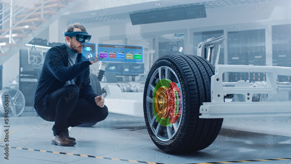 Automotive Engineer Working on Electric Car Chassis Platform, Using ...