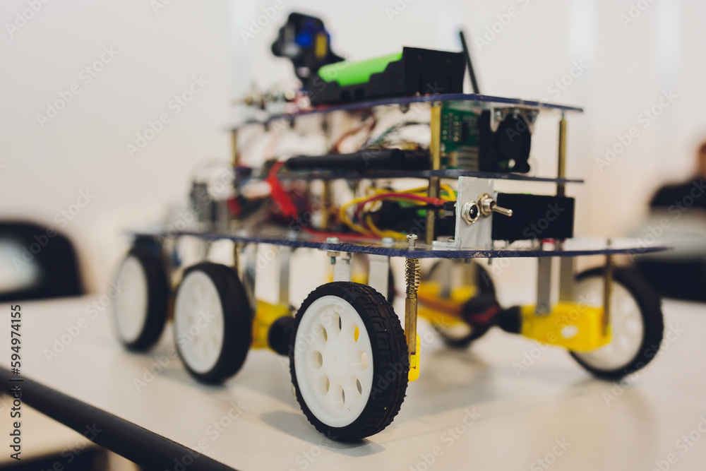 Homemade robot on wheels with eyes. Hobby robotics. Stock Photo | Adobe ...
