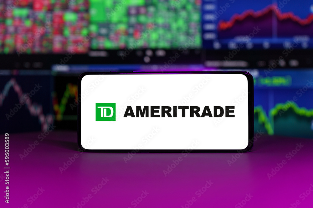 Ameritrade on stock market index in front of stock market charts ...