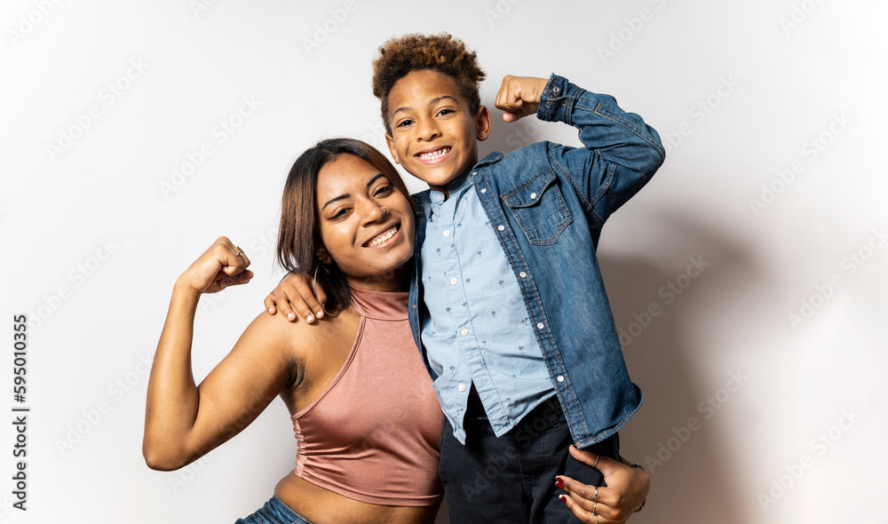 Two dark-skinned brothers pose on a white background. Straight-haired ...