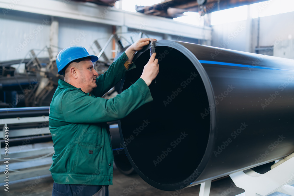 The process of measuring the thickness of a pipe using a caliper with a ...