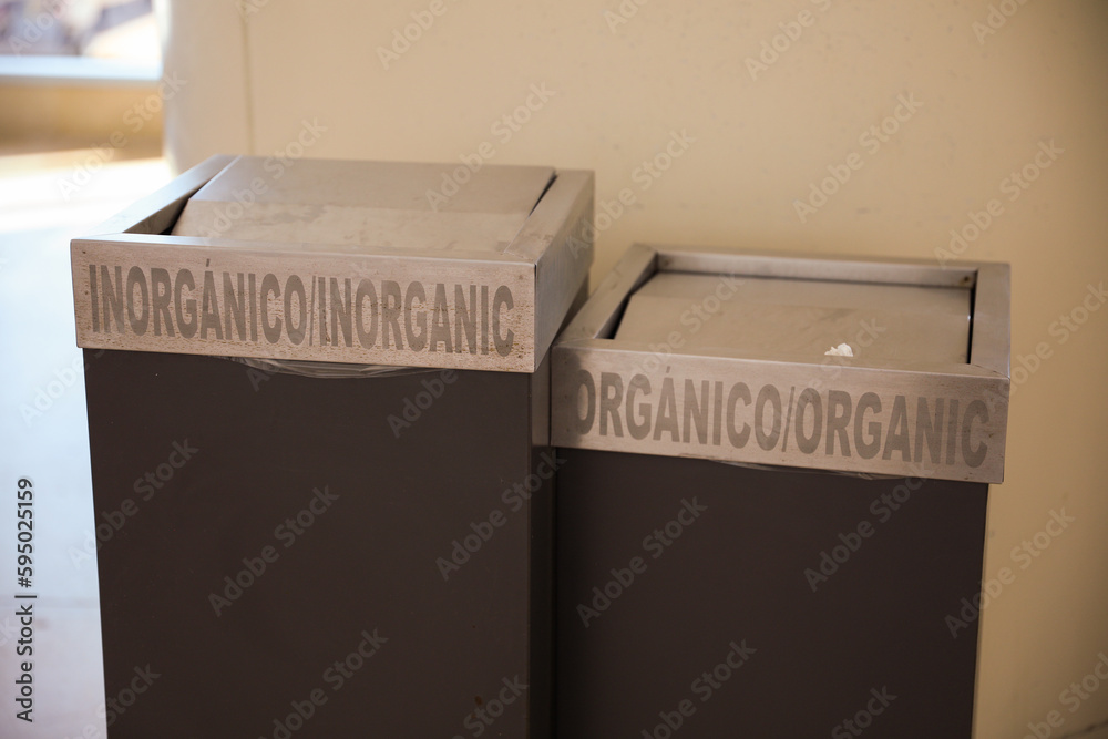 overflowing trash can next to recycling bins symbolizes the importance ...