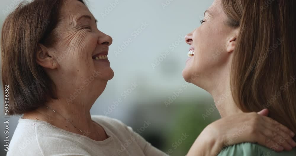 Close up portrait two generation women, older mother, young adult ...