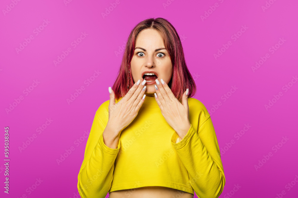 shocked and concerned woman holding hands on face, open mouth and ...