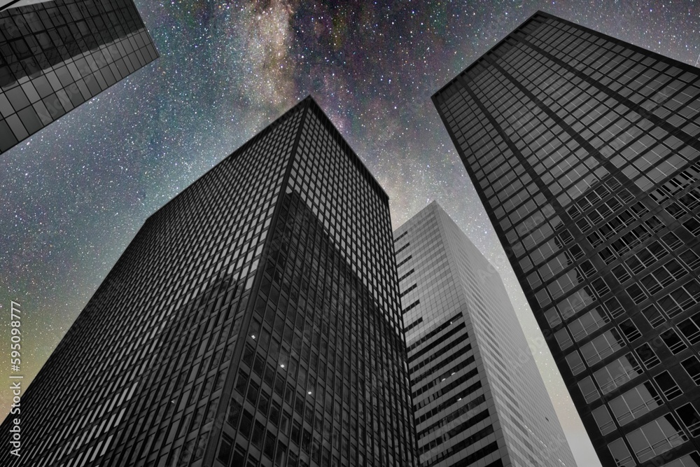 some tall buildings under a starry sky with stars in the sky Stock ...