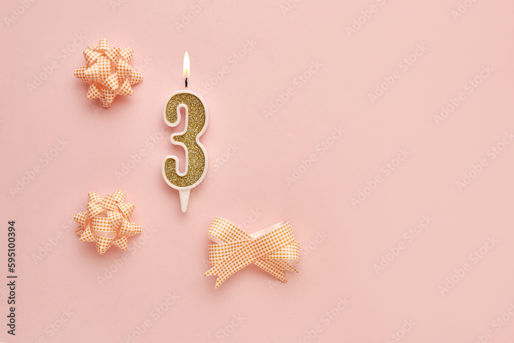 Number 3 on a pastel pink background with festive decorations. Happy ...