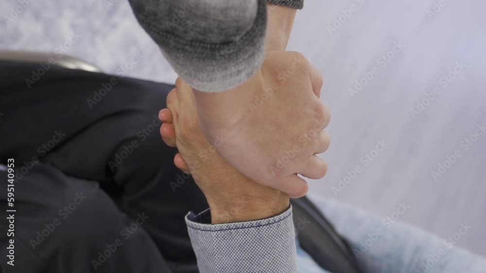 Vertical Video of Friendly handshake. Helping disabled man, giving ...