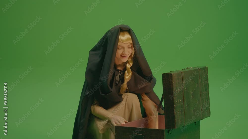 Green Screen. A Magical Girl in a Medieval Dress Opens a Magic Chest ...
