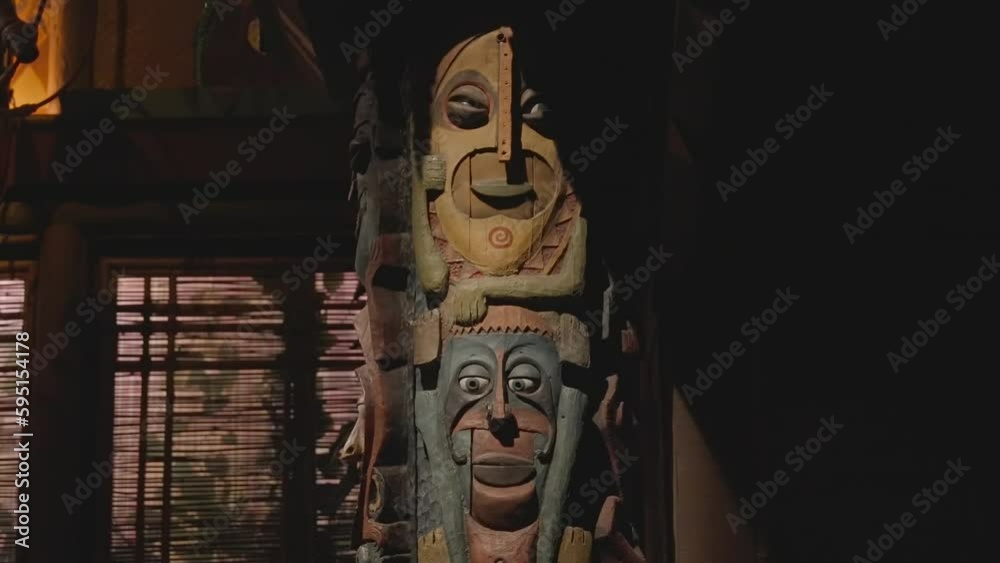 This video shows an animatronic tiki totem moving it's facial features ...