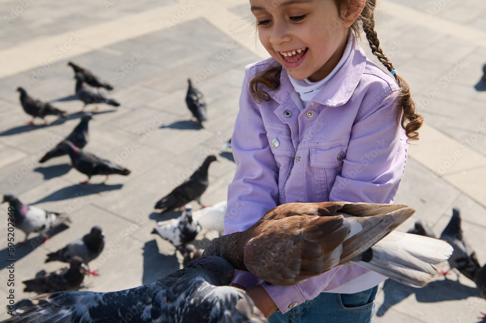 Selective focus. Overjoyed excited Caucasian little kid girl, smiling ...