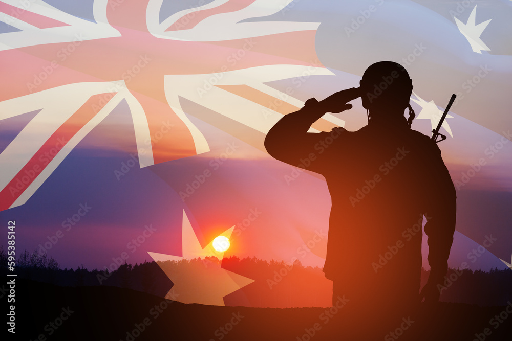 Silhouette of soldier saluting on background of Australia flag and the ...