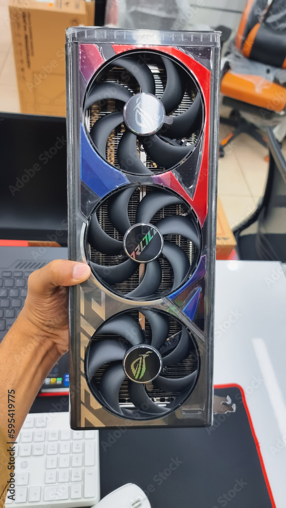 Male holding ASUS ROG STRIX Nvidia GeForce RTX 4090 GPU 24GB Tweak III ...