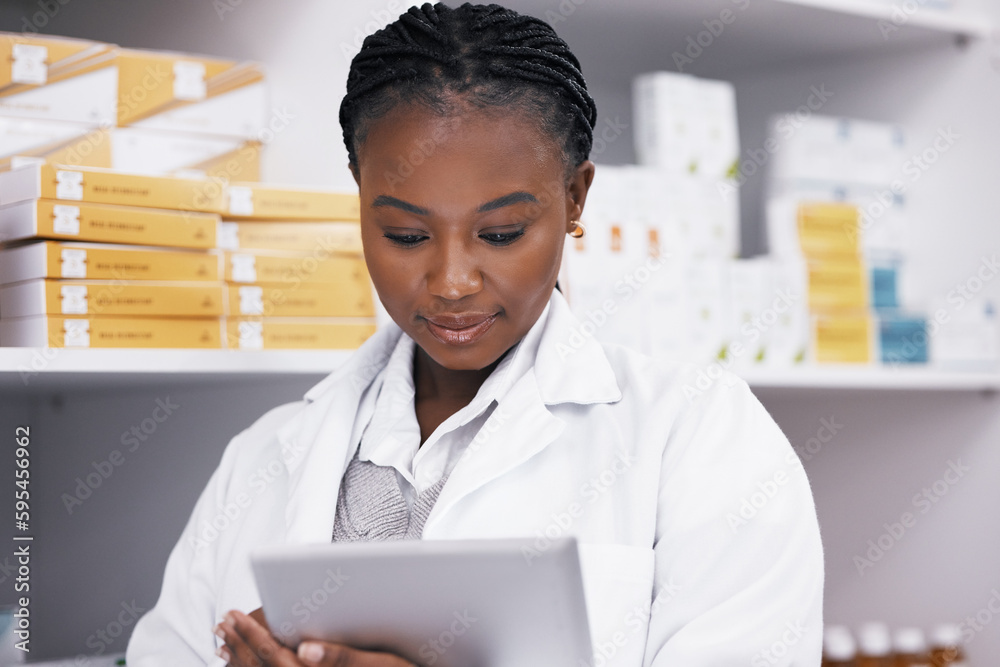 Black woman in pharmacy with tablet, online inventory list and ...