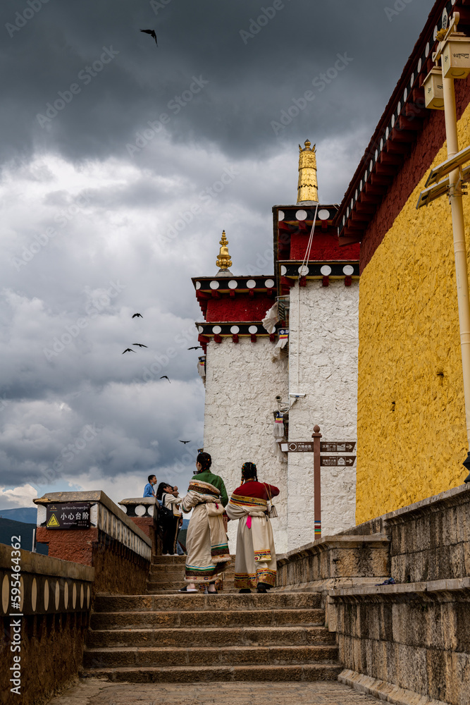 JULY, 24TH, 2021. SHANGRI-LA, YUNNAN, CHINA. Girls wearing traditional ...