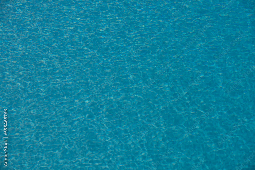 Ripped water in swimming pool. Surface of blue swimming pool ...