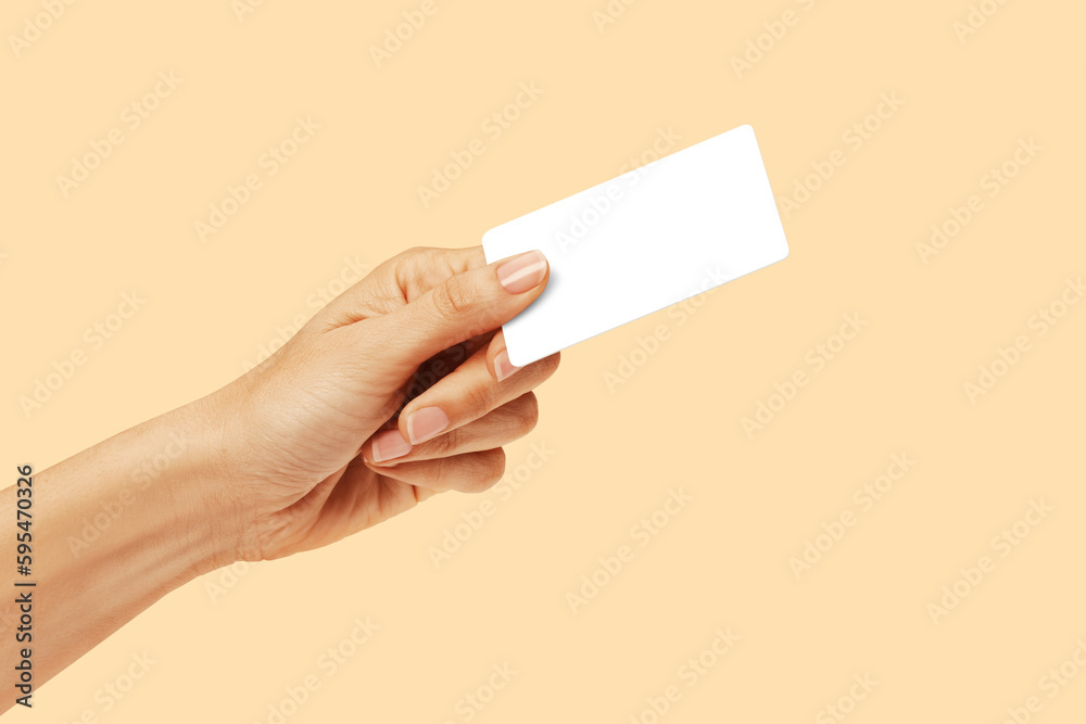 Woman's hand showing credit card, or card, or business card or voucher ...