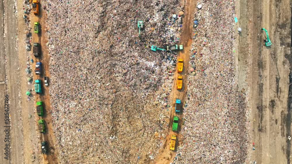 As more waste is deposited in the landfill, the garbage pile grows in ...