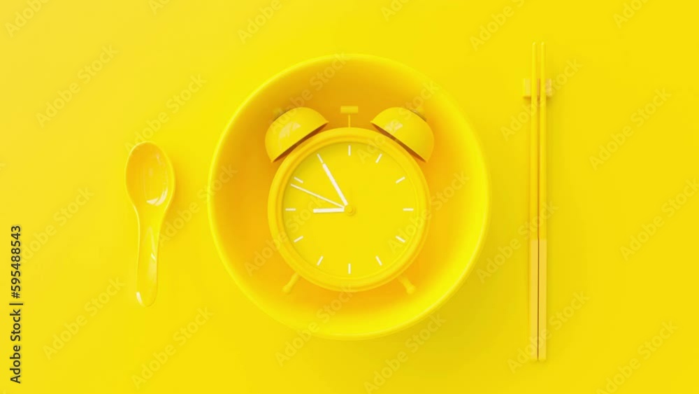 alarm clock timelapse on plate bowl spoon and chopstick on yellow ...
