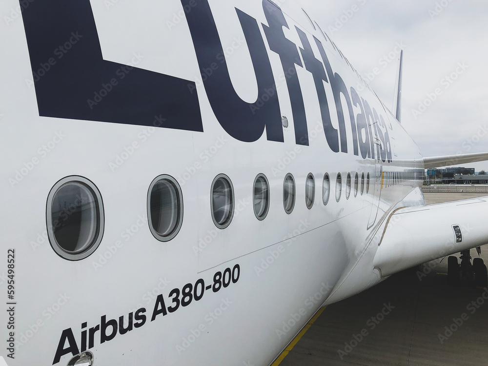 Partial view of Lufthansa A380 fuselage with cabin windows and livery ...