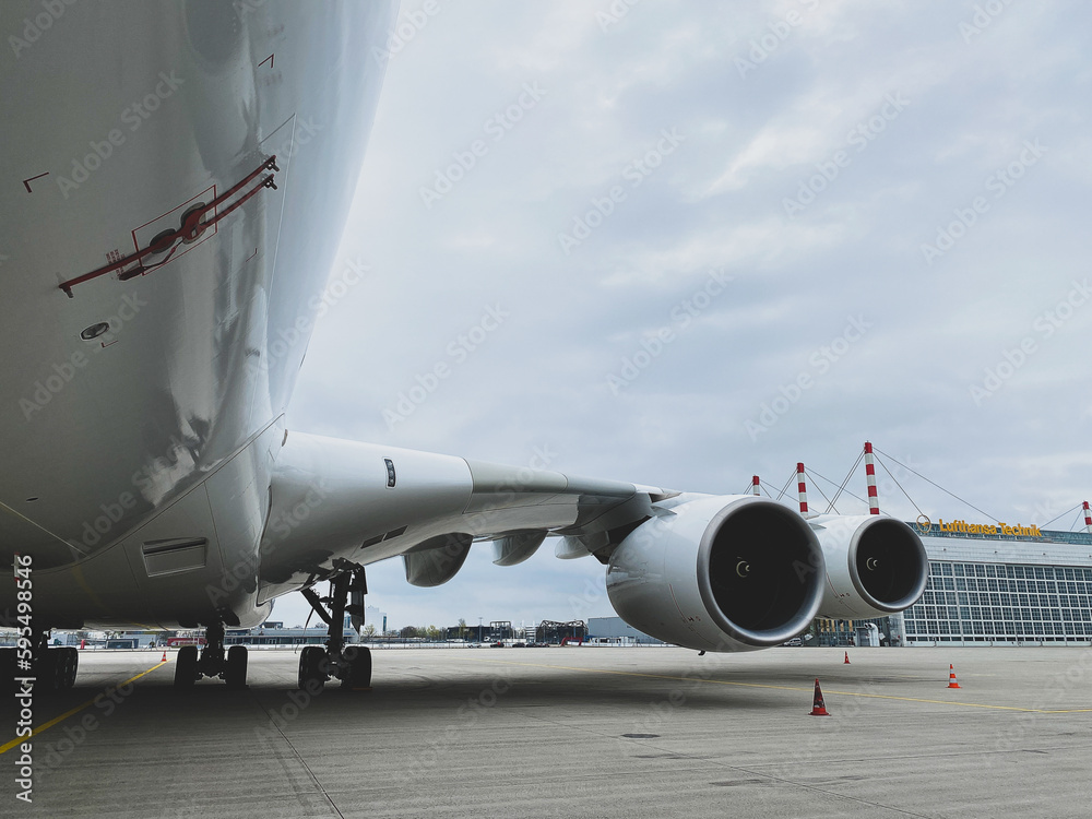 Close up view of main landing gear and parts of wing and fuselage of ...
