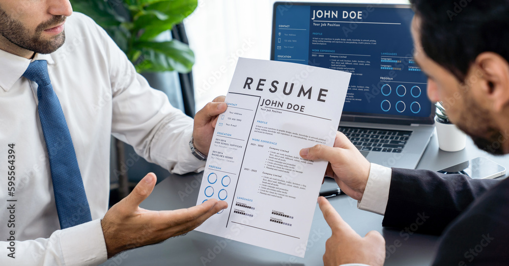 Interviewing job applicant in office with resume paper. Candidate wear ...