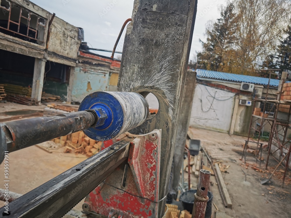 Hole cutting machine. Drilling concrete with an industrial drilling ...