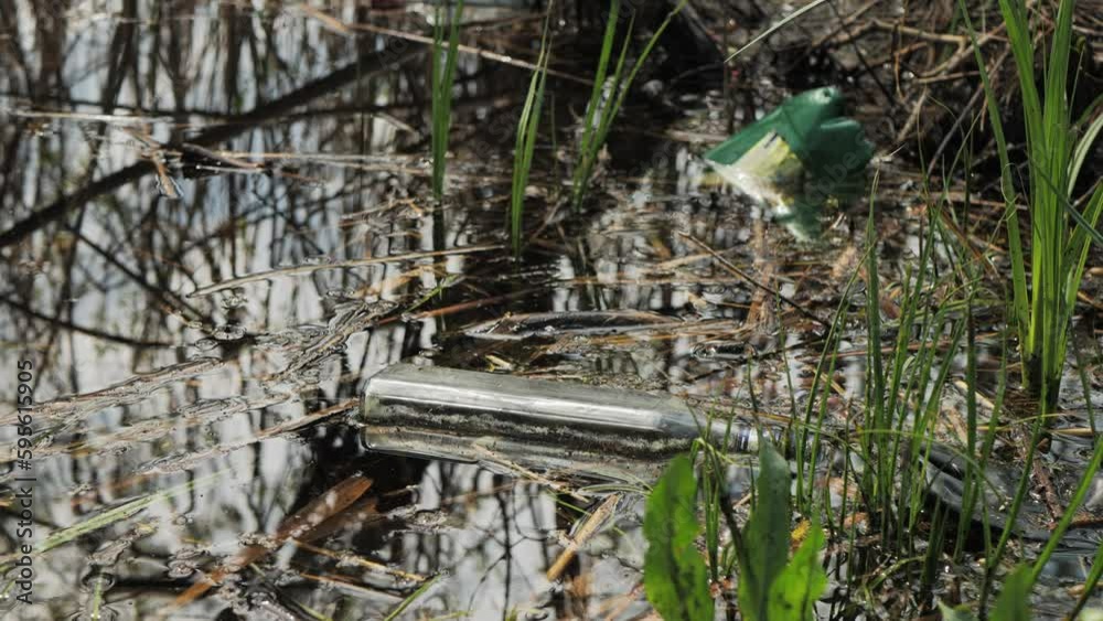 Stockvideon pollution of water bodies with garbage. plastic waste in ...