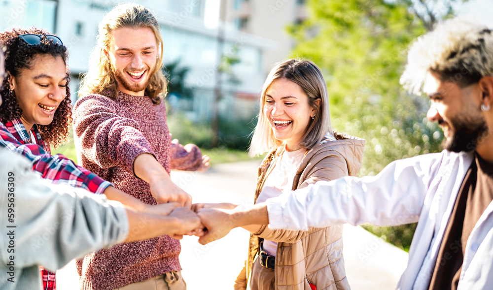 Foto de Young millenial best friends bumping fist on unity move - Multi ...
