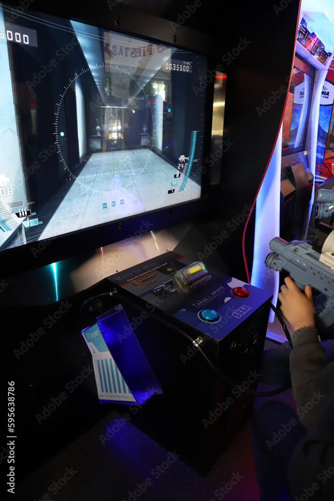 Arcade game room. Video game park for children and teenagers. Boy ...