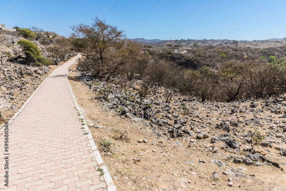 Park near the Tawi Atair Sinkhole Oman, the most famous sinkhole in the ...