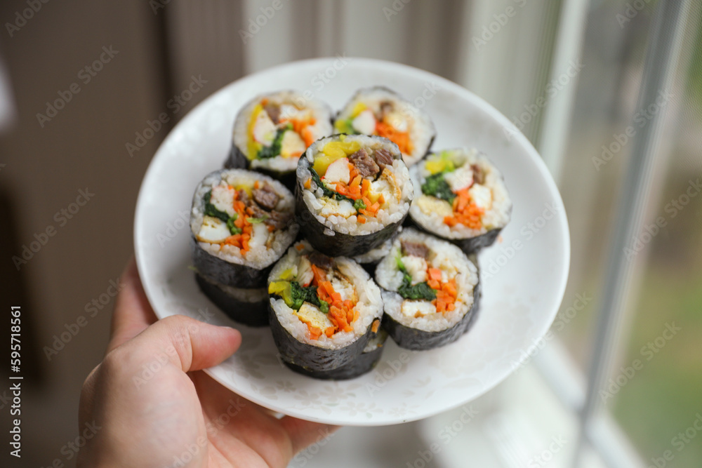 Kimbap is a traditional Korean dish made of rice, vegetables, and meat ...