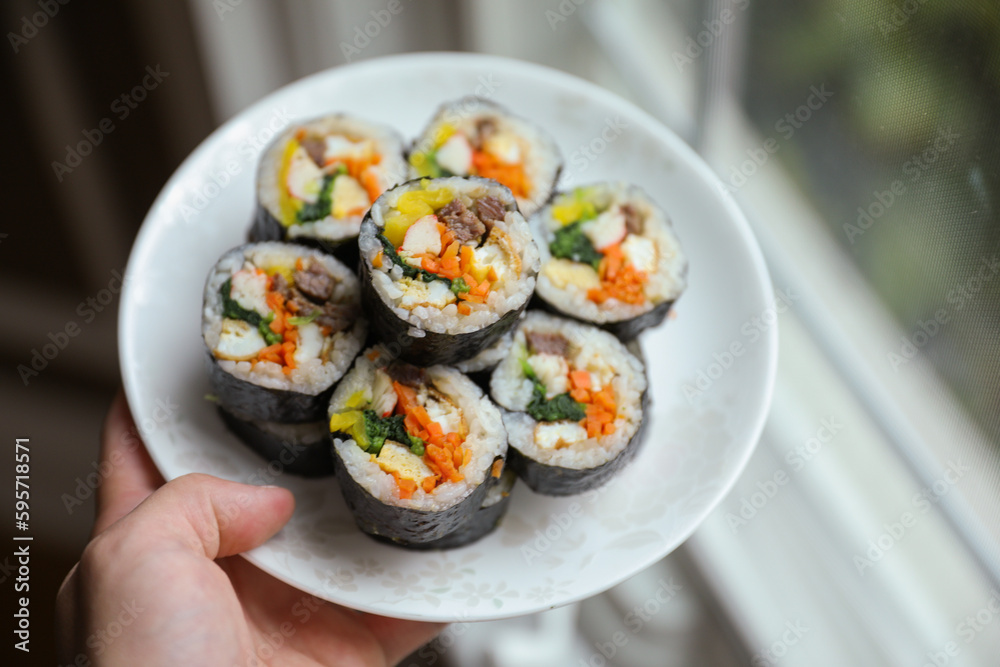 Kimbap is a traditional Korean dish made of rice, vegetables, and meat ...
