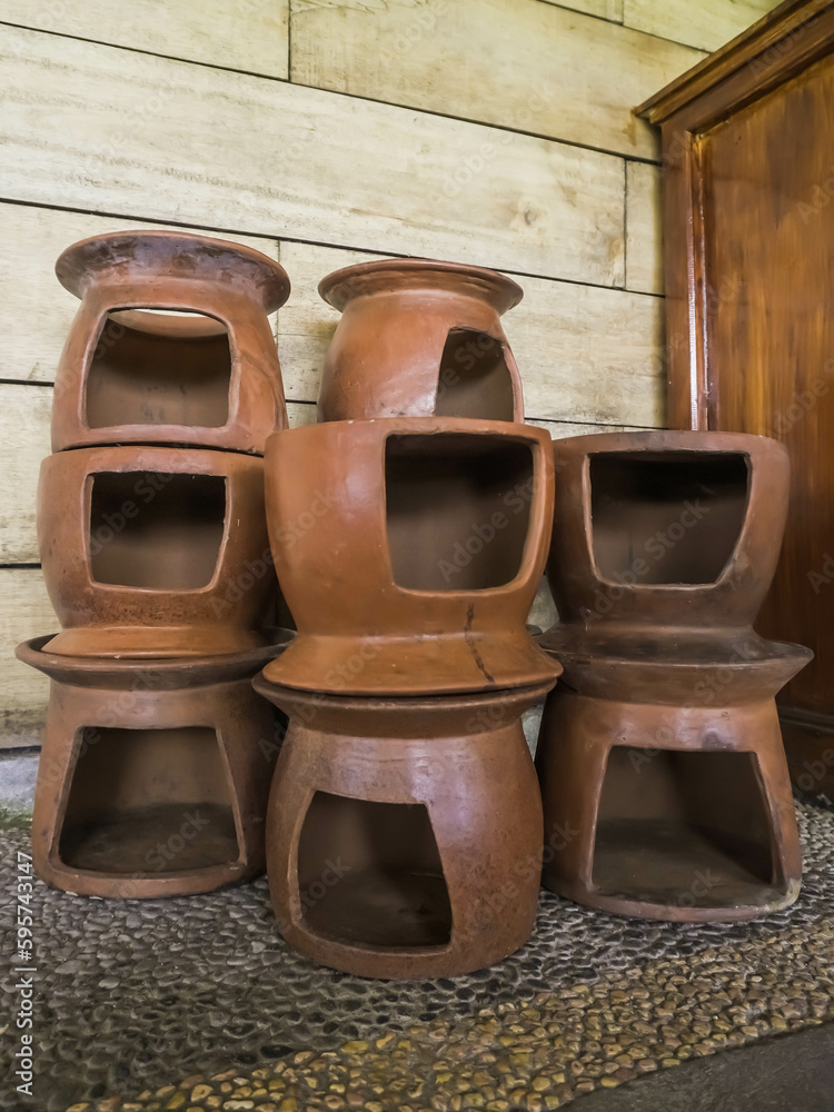 Stacked Balinese pottery and earthenware kitchen utensil. Traditional ...