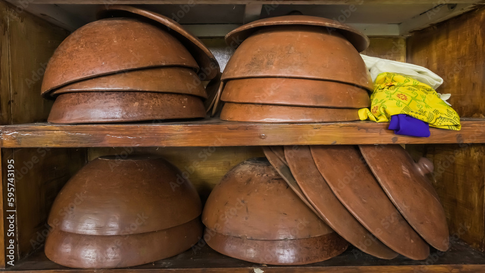 Stacked Balinese pottery and earthenware kitchen utensil. Traditional ...