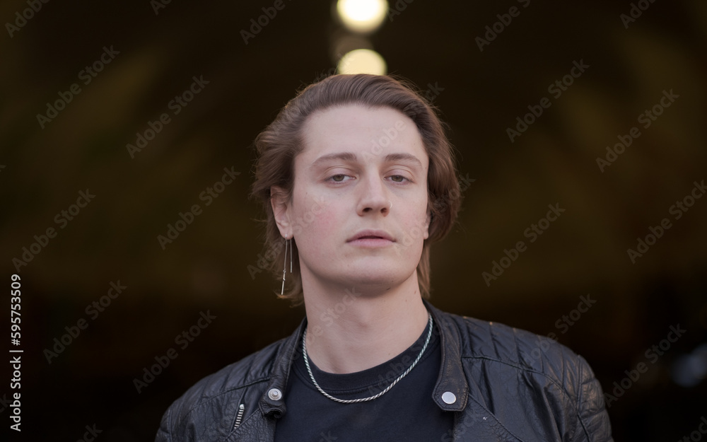 A genderfluid (LGBTQ) model poses outside, in front of a tunnel, to ...