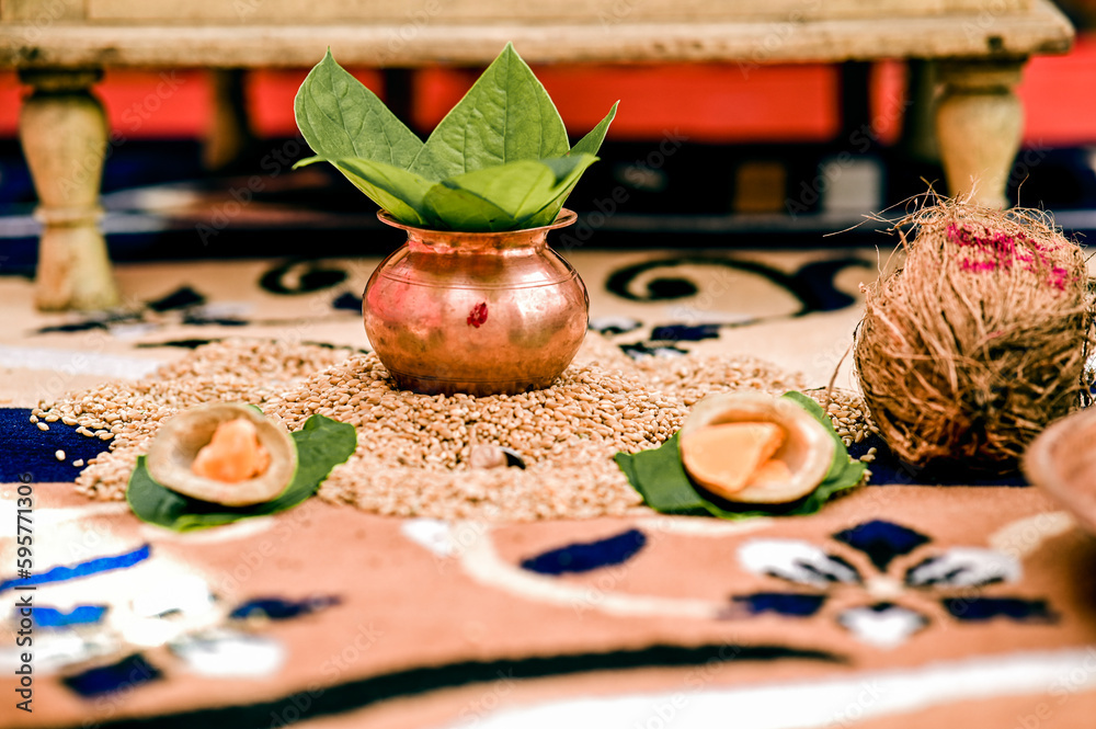 Pot with betel leaf and coconut and wheat seeds for hindu engagement ...