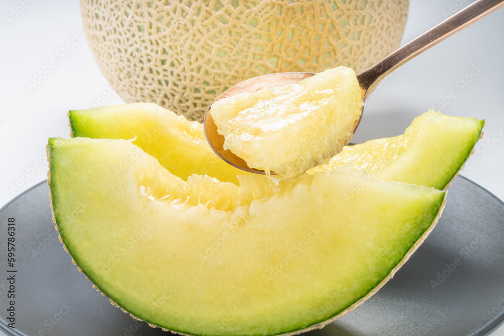 Poster Golden spoon with Crown Musk Melon on white background, Shizuoka ...