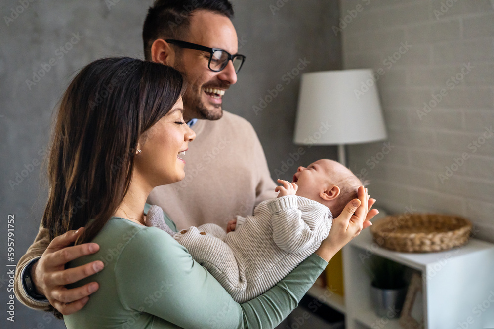 Peaceful young married couple enjoying being family, parents, holding ...