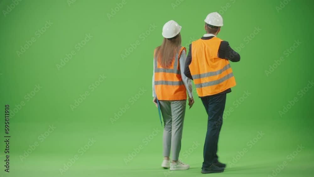 Green Screen.Female and Male Workers Partners in Safety Jackets and ...